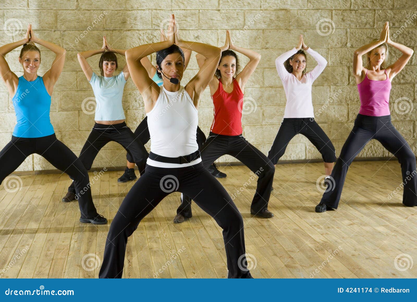 Exercising with Fitness Instructor Stock Photo - Image of group, club ...
