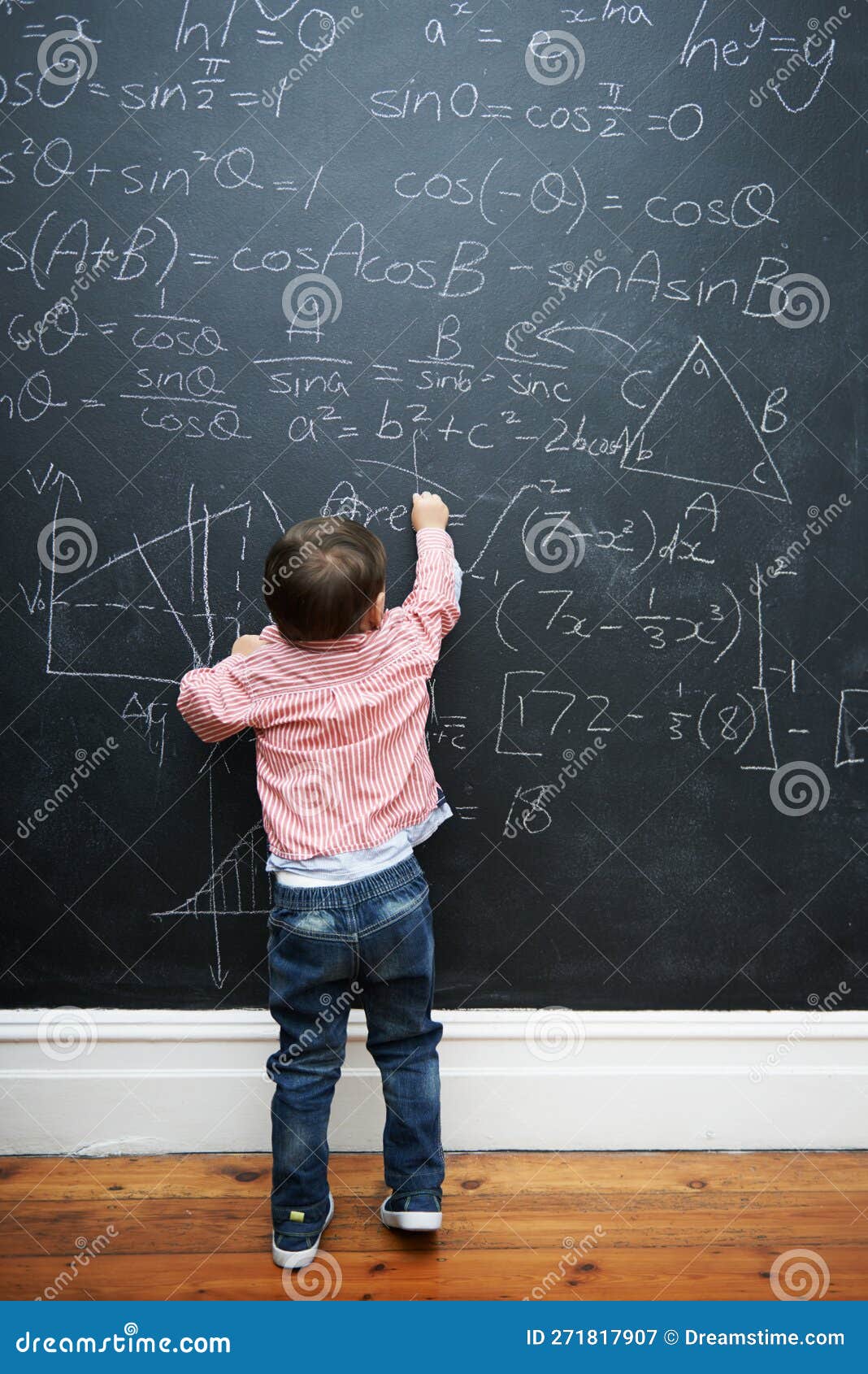 Exercising the Mind. Studio Shot of a Young Boy with a Blackboard Full ...