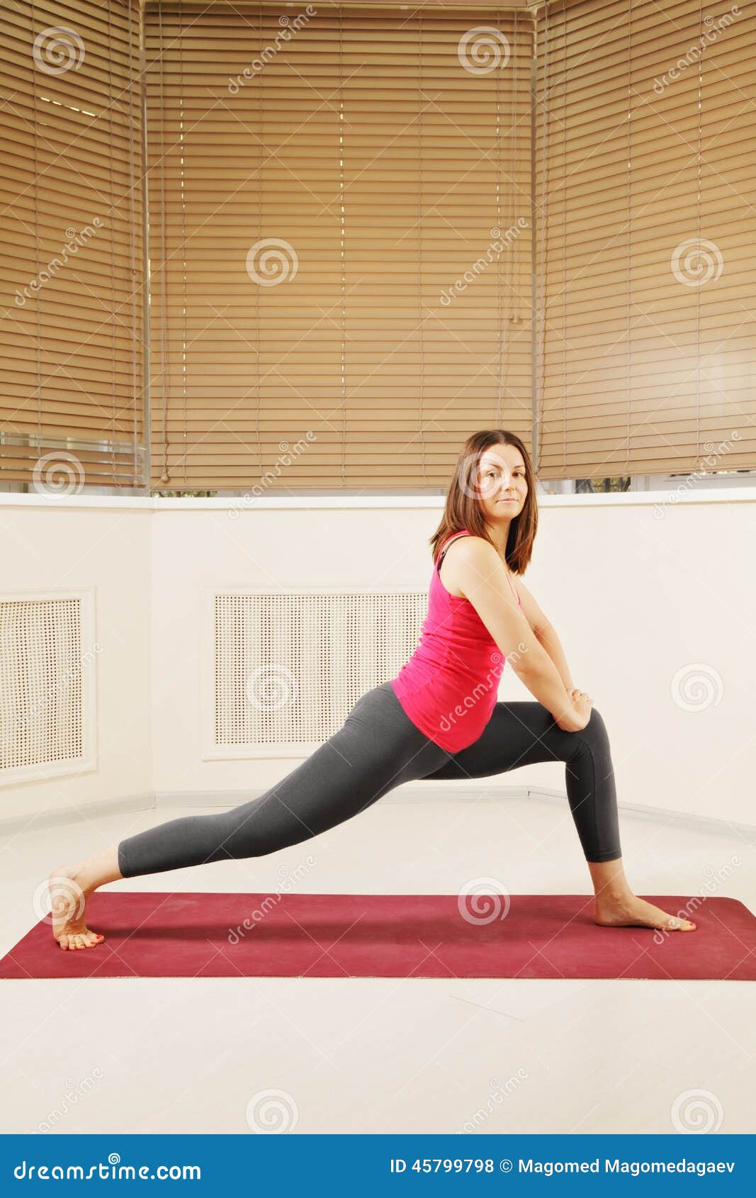 Exercising Stretching Yoga Pose Stock Photo - Image of indoors, woman ...