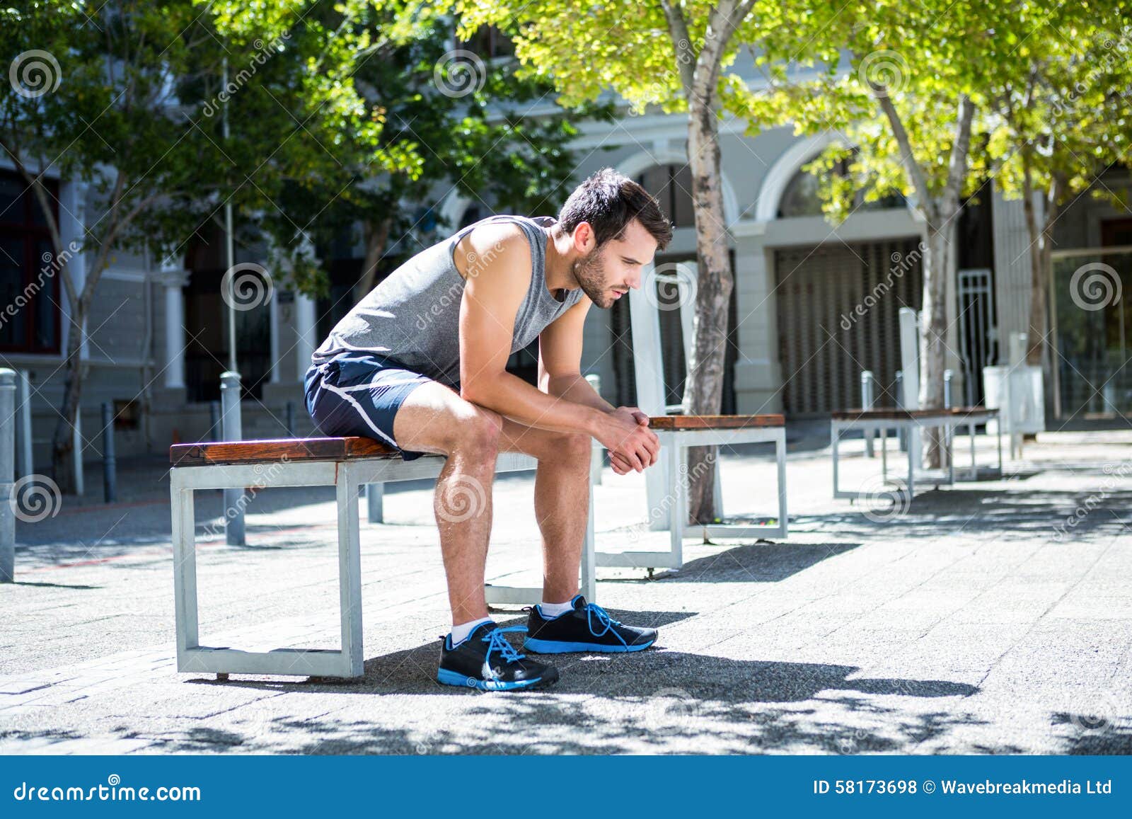 Exhausted Athlete Resting on a Bench Stock Photo - Image of body ...