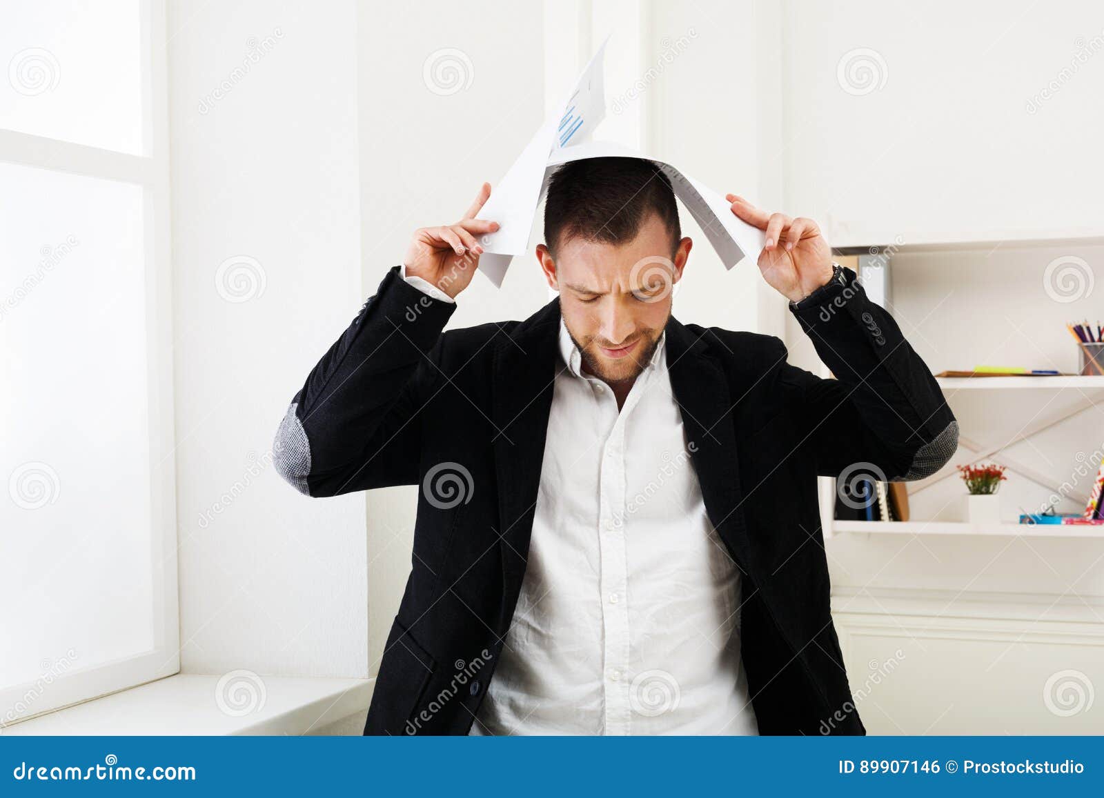 Exhausted Businessman Holding Documents Over Head Stock Photo - Image ...