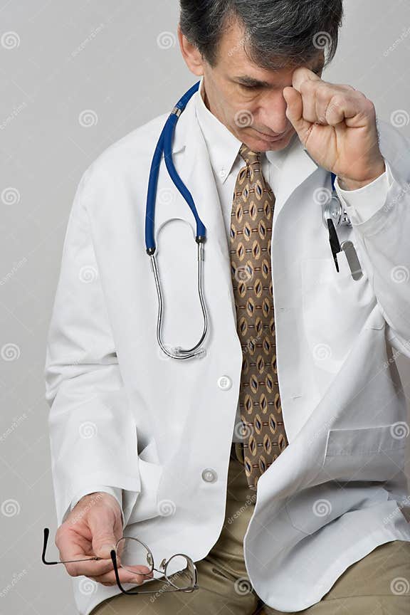 Exhausted, Frustrated Doctor Stock Photo - Image of male, fatigue: 9765268