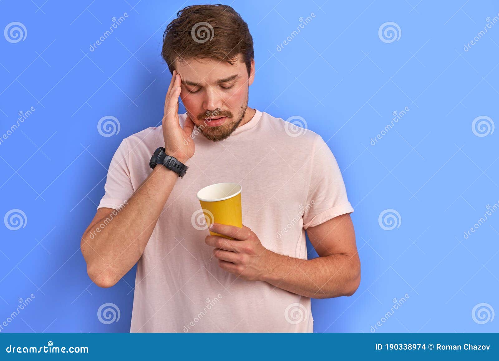 Exhausted Guy Drinking Coffee Isolated in Studio Stock Photo - Image of ...