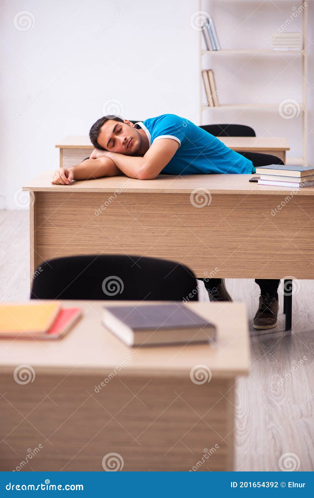 Exhausted Male Student Preparing for the Exams in the Classroom Stock ...