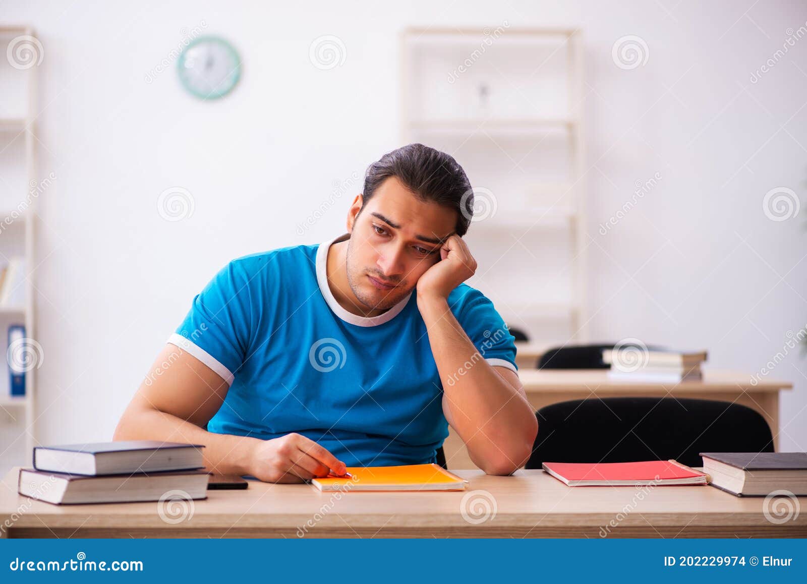 Exhausted Male Student Preparing for the Exams in the Classroom Stock ...