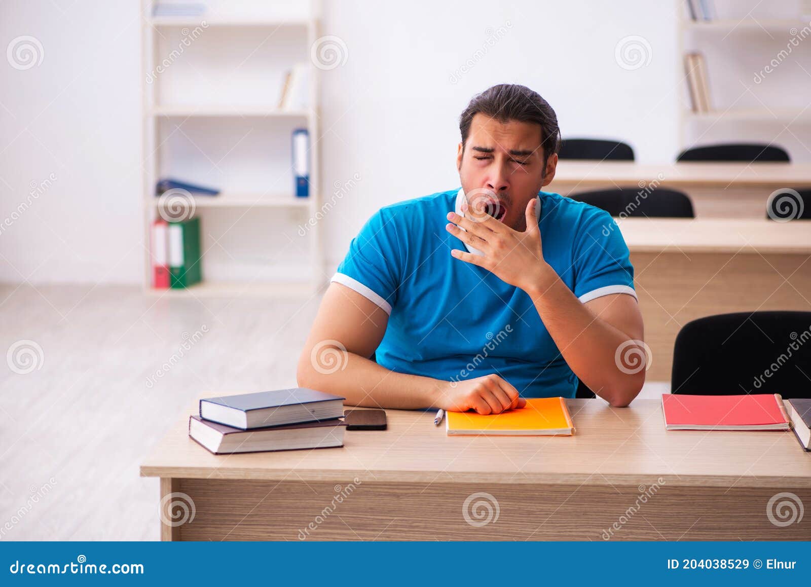 Exhausted Male Student Preparing for the Exams in the Classroom Stock ...