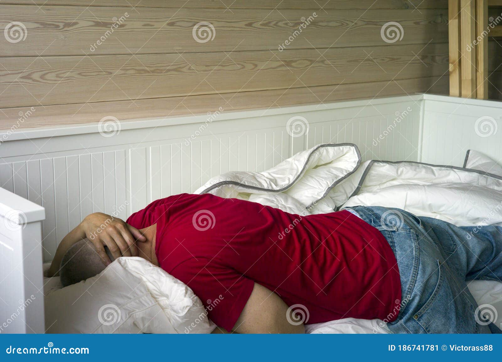 Sleeping exhausted man stock image. Image of room, bedroom - 186741781