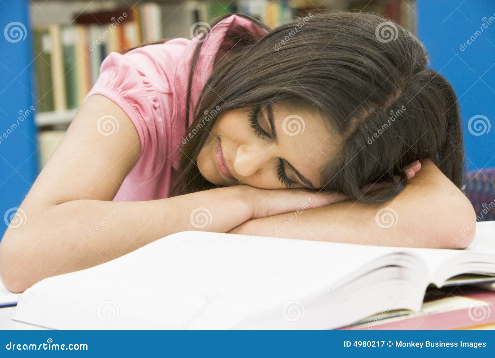 Exhausted University Student in Library Stock Image - Image of research ...