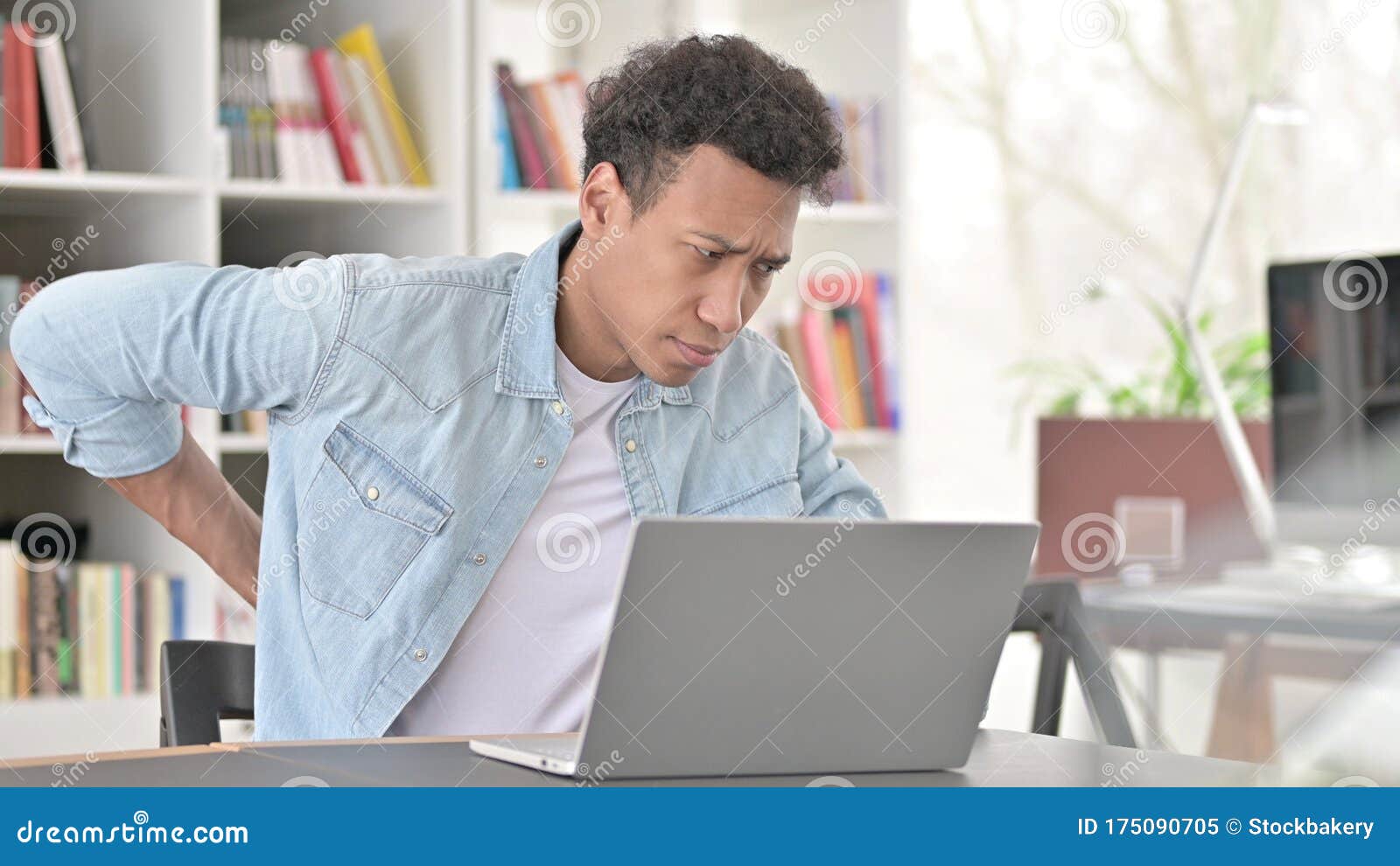 Exhausted Young African American Man Having Back Pain at Work Stock ...
