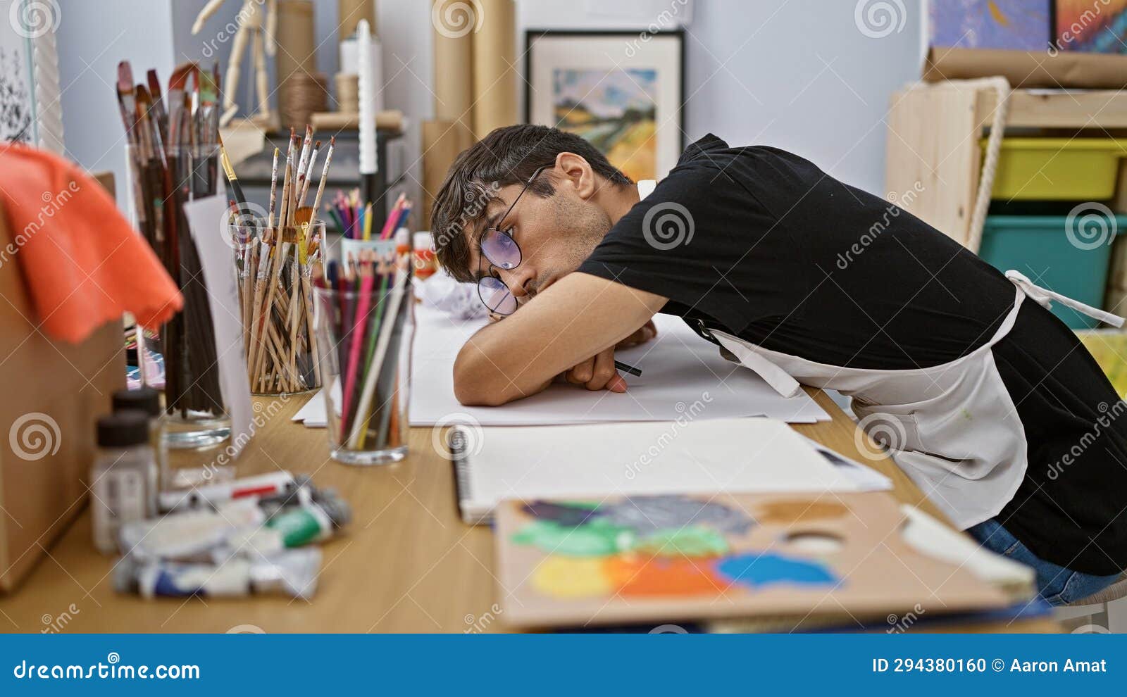Exhausted Young Hispanic Man, an Art Student, Immersed in His Drawing ...