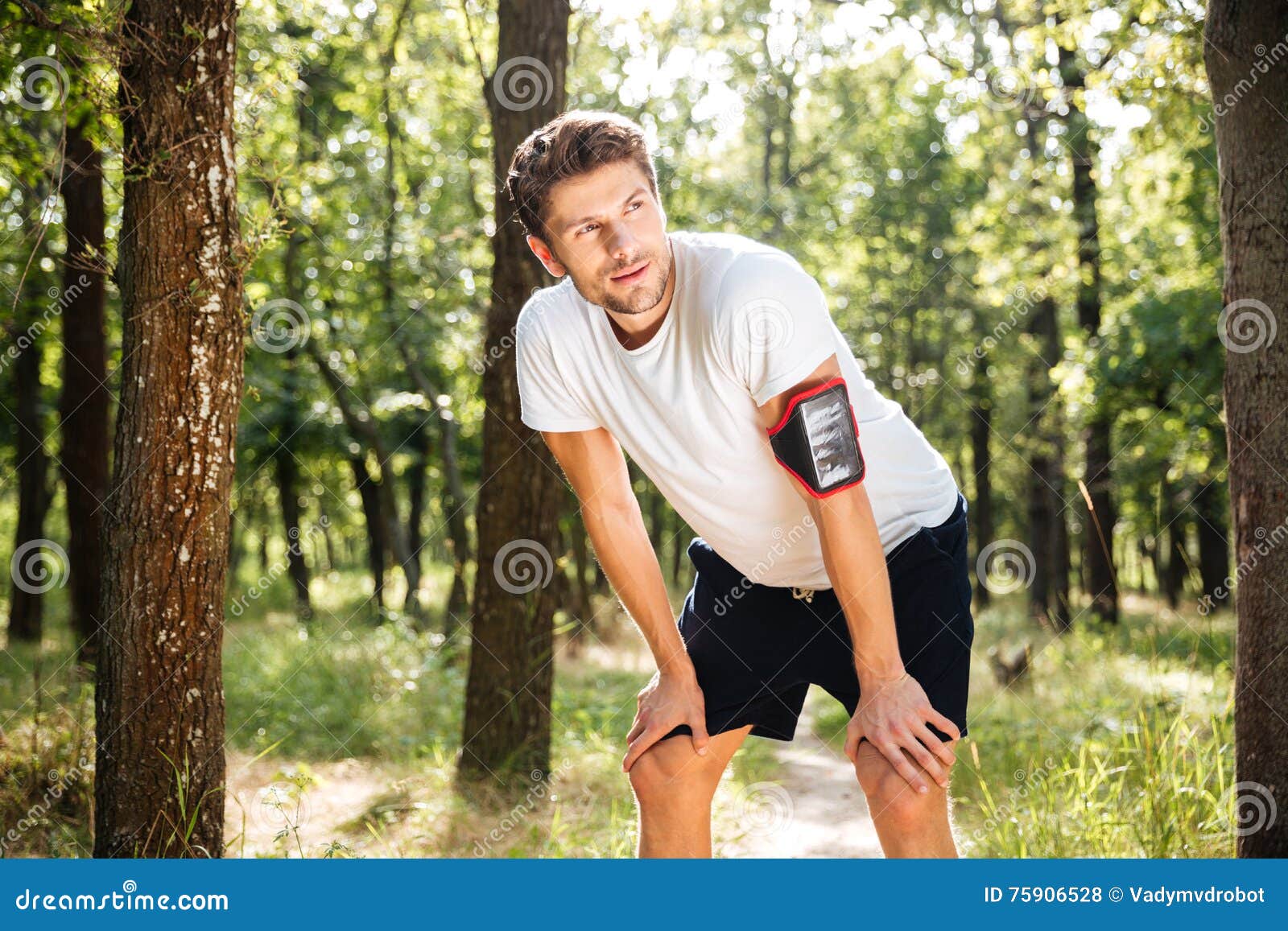 Exhausted Young Man Athlete Standing after Running in Forest Stock ...