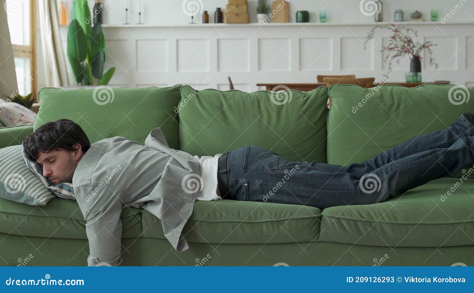 Exhausted Young Man Came Home after Work Flopped Down on Sofa Stock ...