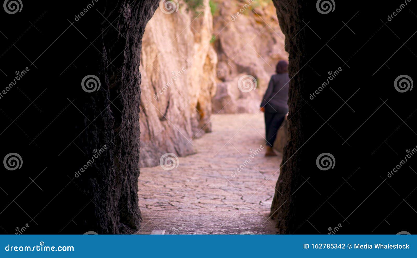 Exit from the Dark Stone Cave with a Woman Standing Outside. Art ...