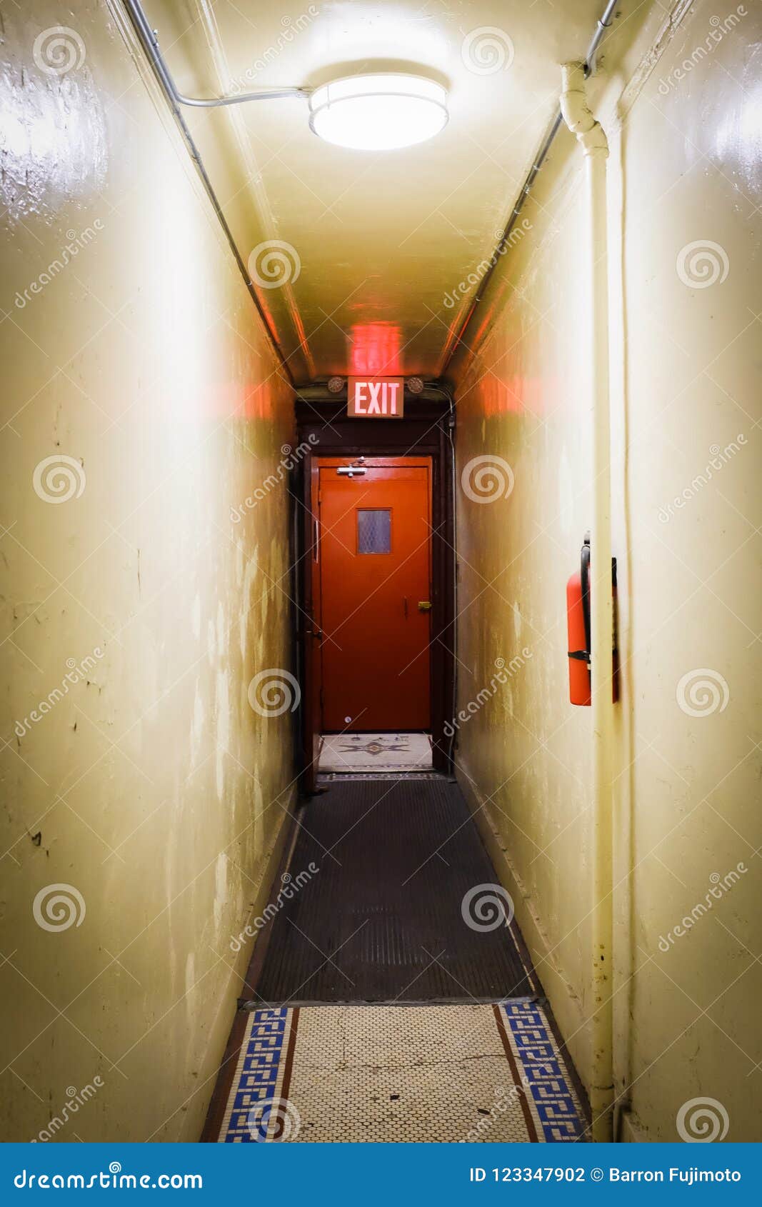 Exit Door at the End of an Aging Hallway Stock Photo - Image of ...