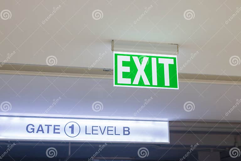 Exit Doors with `Excit` Hanging Signs Stock Image - Image of exit ...