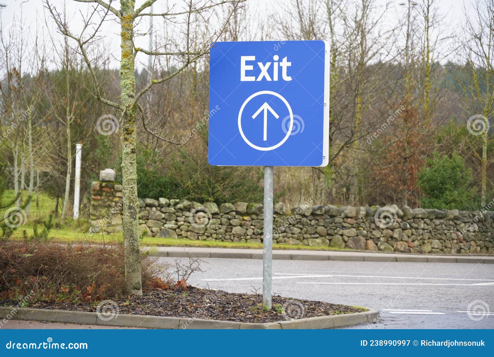 Exit Sign on Blue Background at Carpark Exit Stock Image - Image of ...