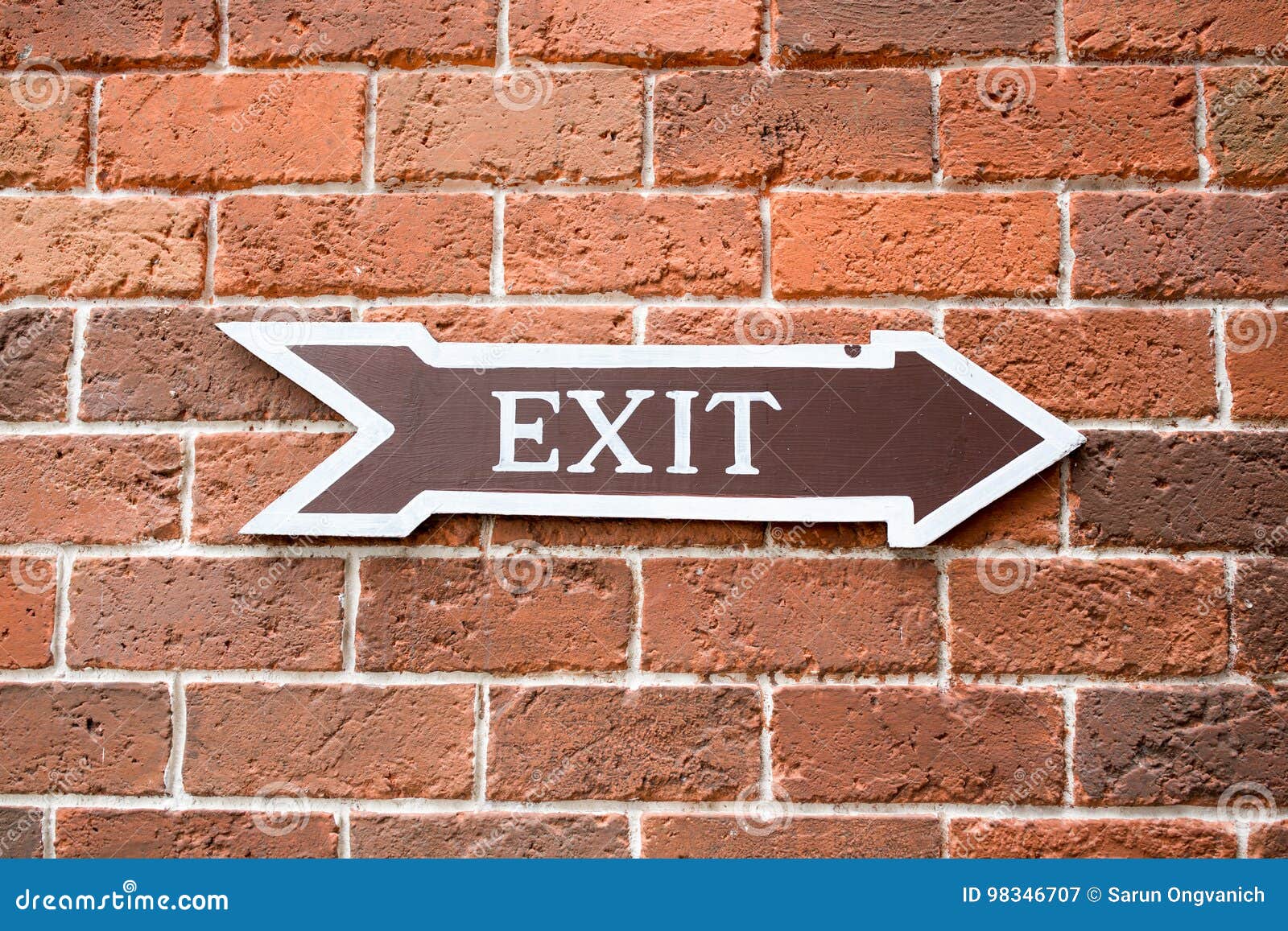 Exit sign on brick wall stock image. Image of arrow, shape - 98346707