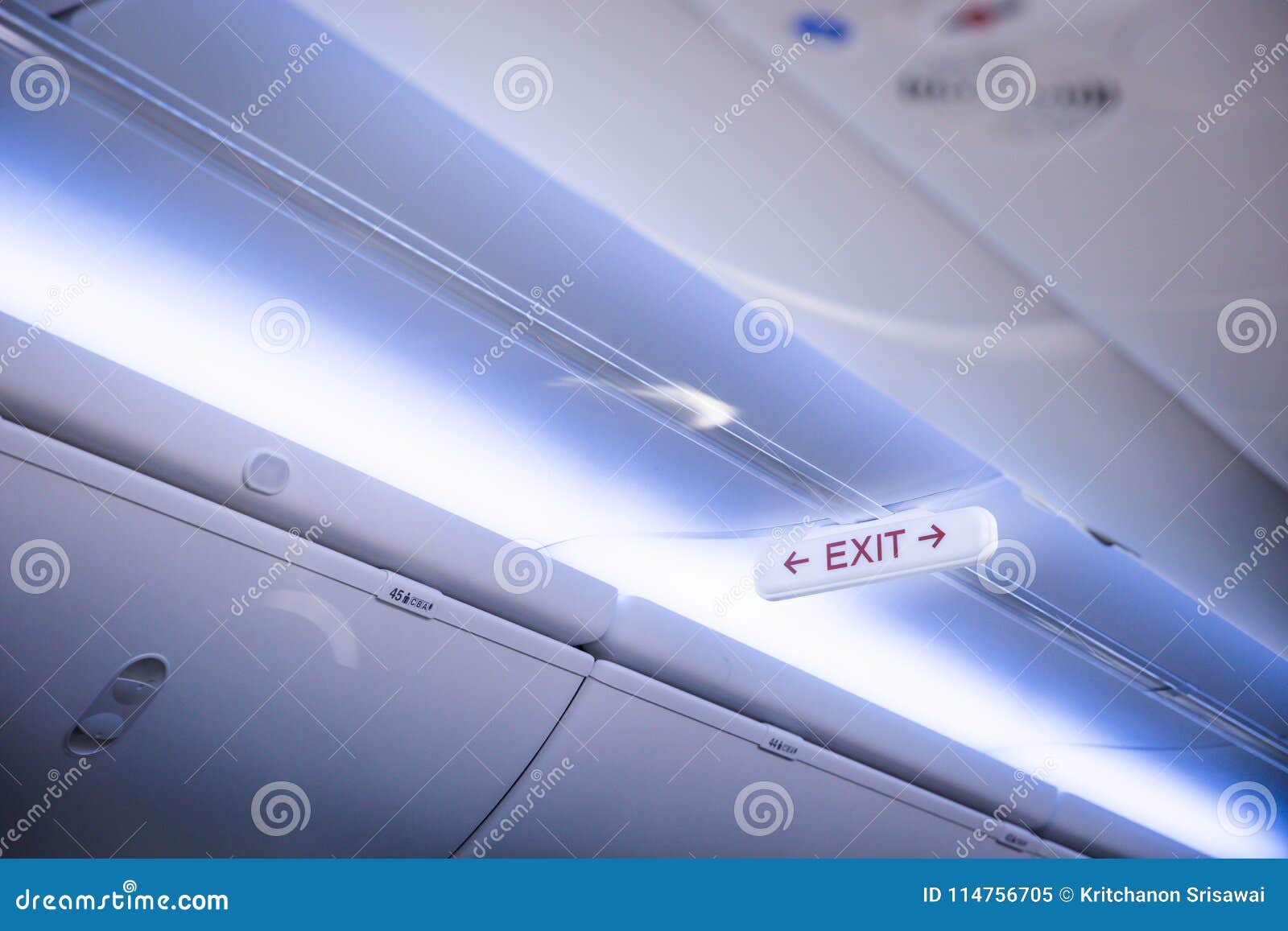 Exit Sign in in the Aircraft Cabin. Stock Image - Image of equipment ...