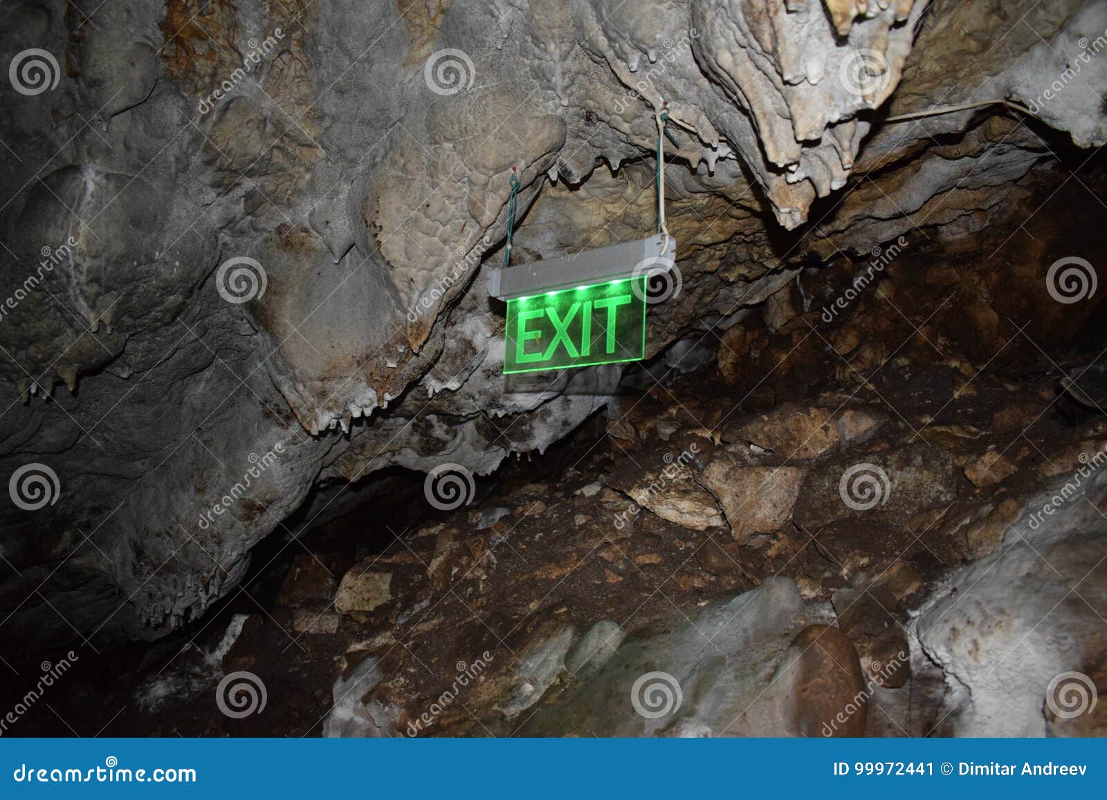 Exit sign in a cave. stock image. Image of cave, exit - 99972441