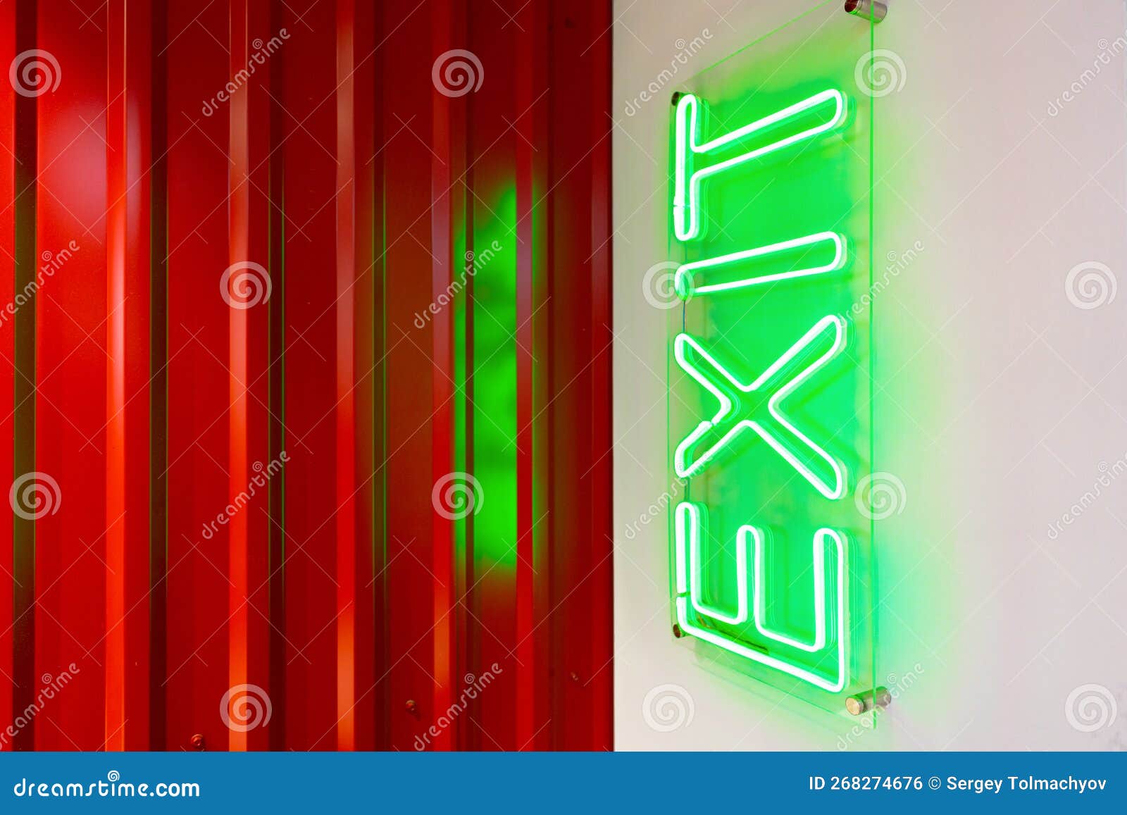 Exit Sign Green Light on the Wall Background Stock Photo - Image of ...