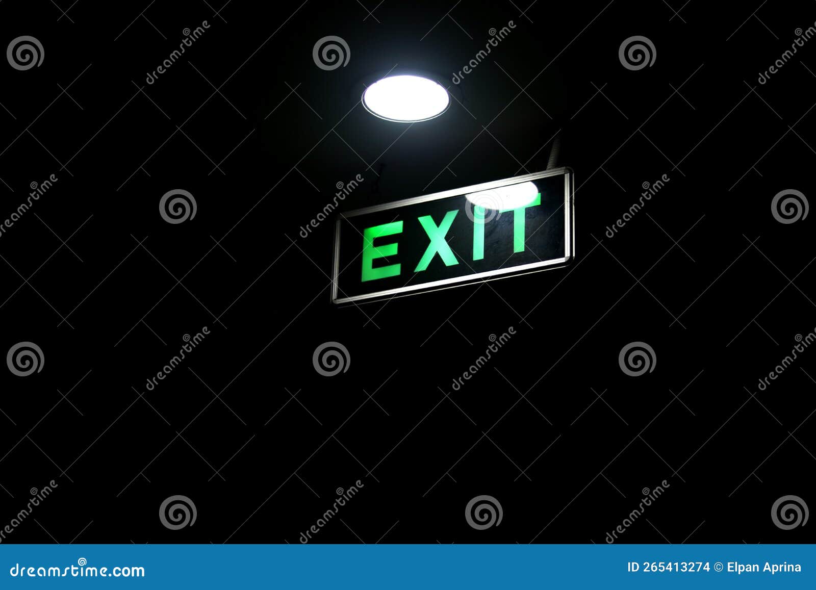 Exit Sign Illuminated by a Single Lamp. Stock Photo - Image of read ...