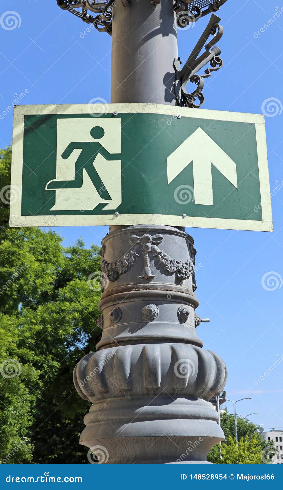 Exit Sign on an Ornate Metal Pole on the Street Stock Photo - Image of ...