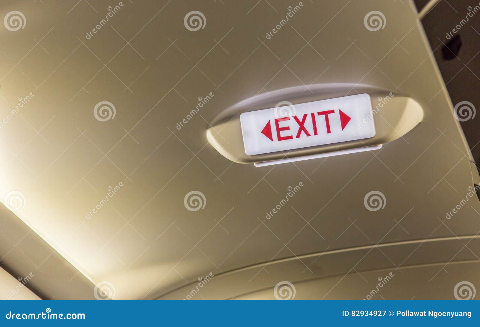 Exit Sign on Overhead in Passenger Airplane Emergency Exit Row I Stock ...