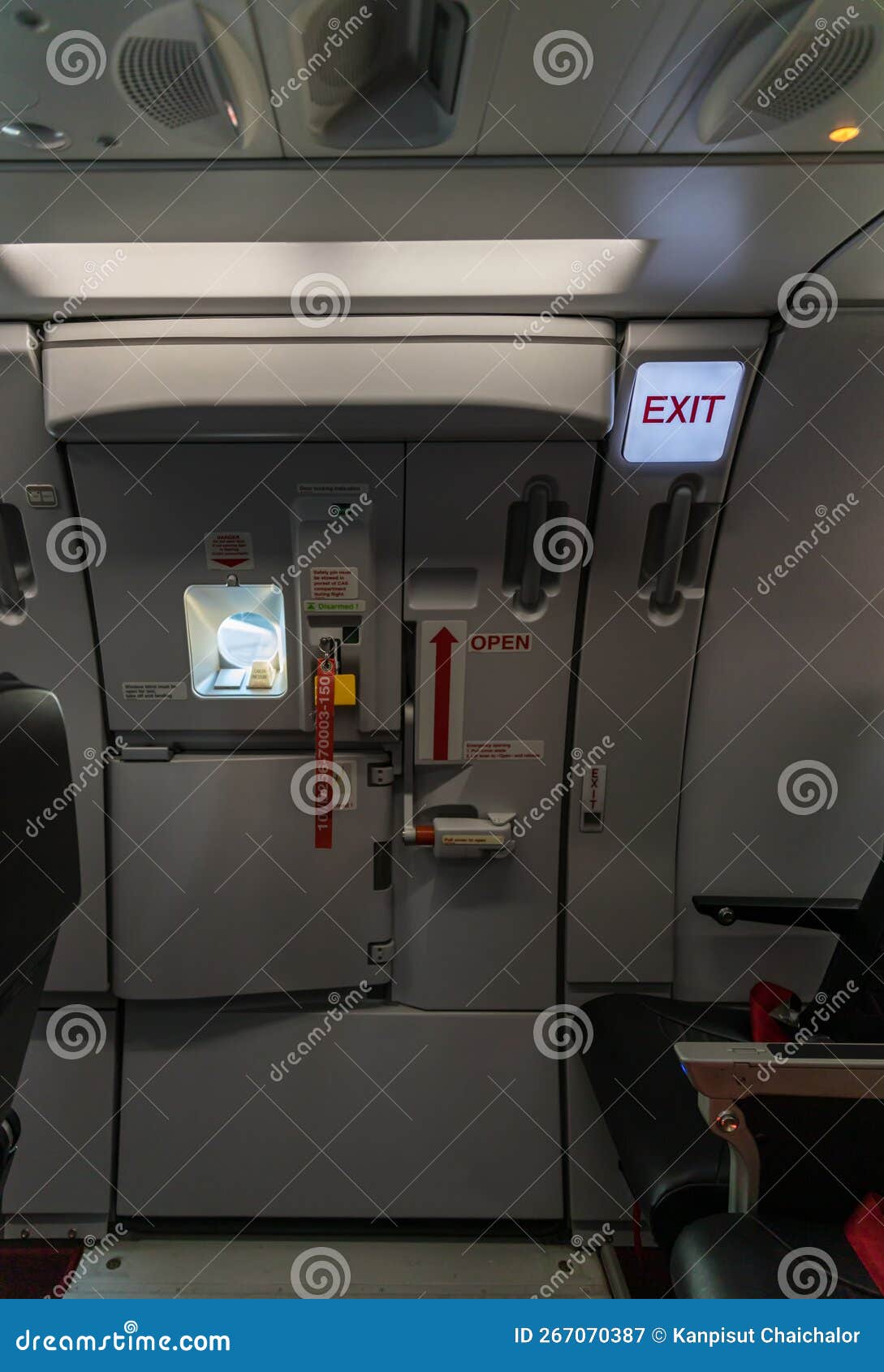Exit Sign in Passenger Airplane. Emergency Exit Sign on Airplane Stock ...