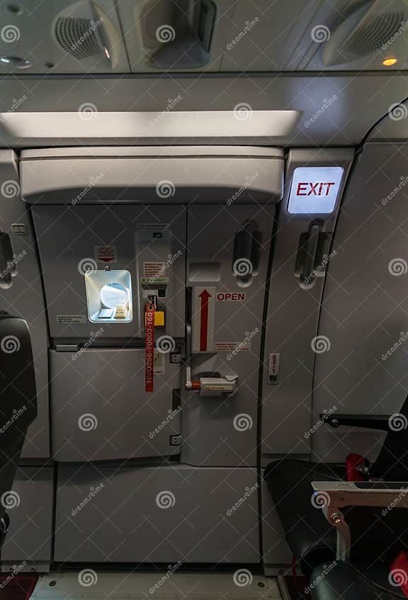 Exit Sign in Passenger Airplane. Emergency Exit Sign on Airplane Stock ...