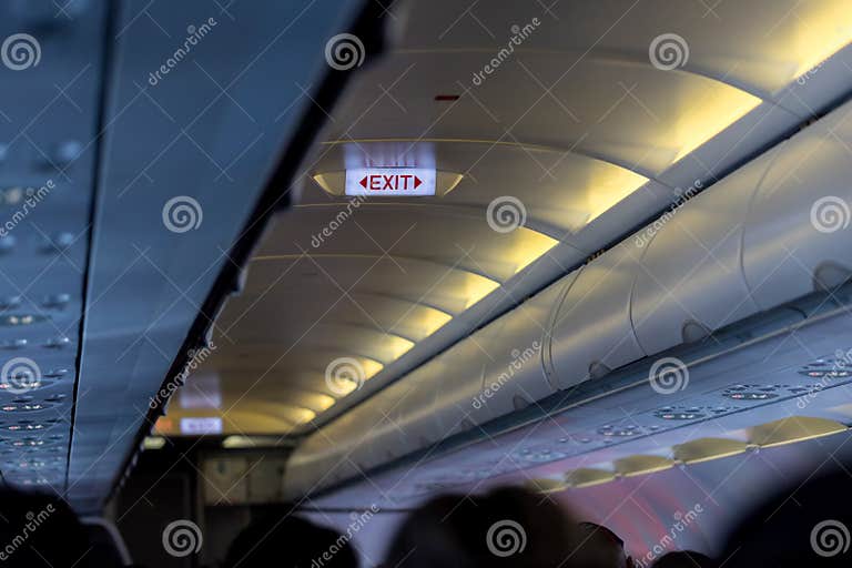 Exit Sign in Passenger Airplane. Emergency Exit Sign on Airplane Stock ...