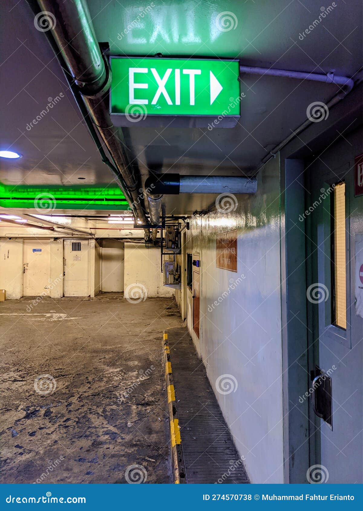 The Exit Sign in the Scary and Lonely Parking Lot Stock Photo - Image ...
