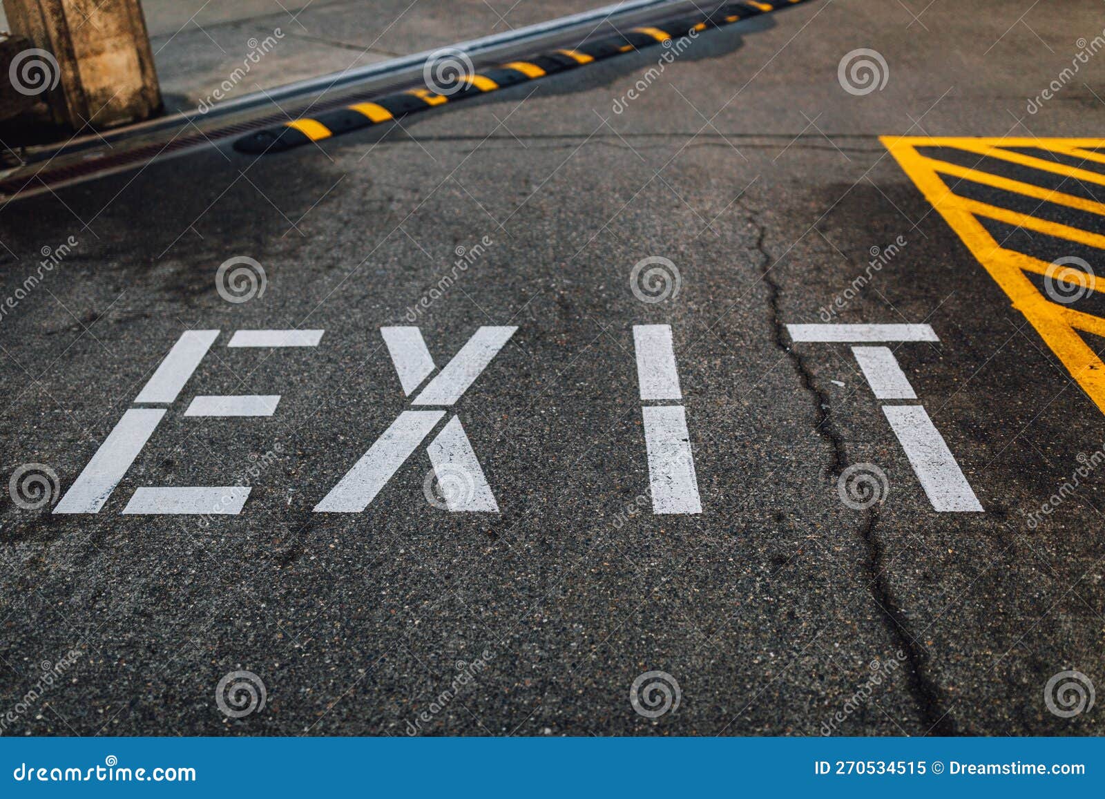 EXIT Sign Stenciled on Ground in Parking Lot Stock Image - Image of ...