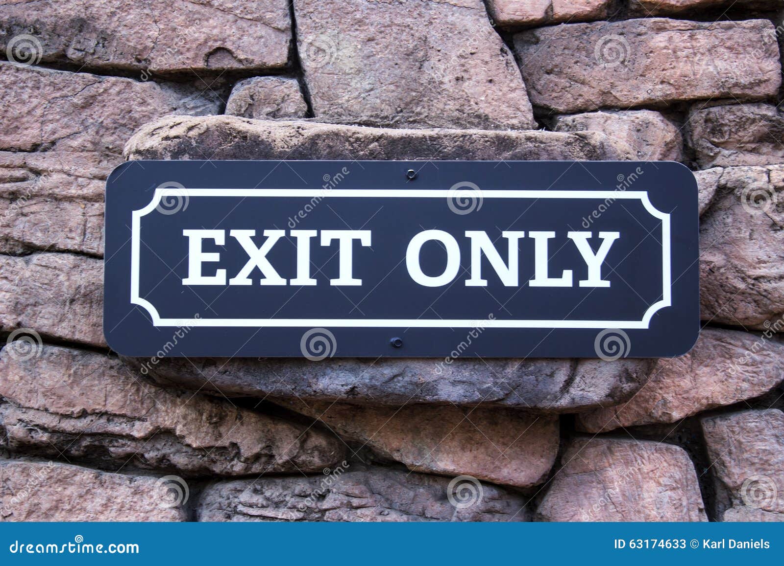 Exit Sign on Stone Wall stock image. Image of executive - 63174633