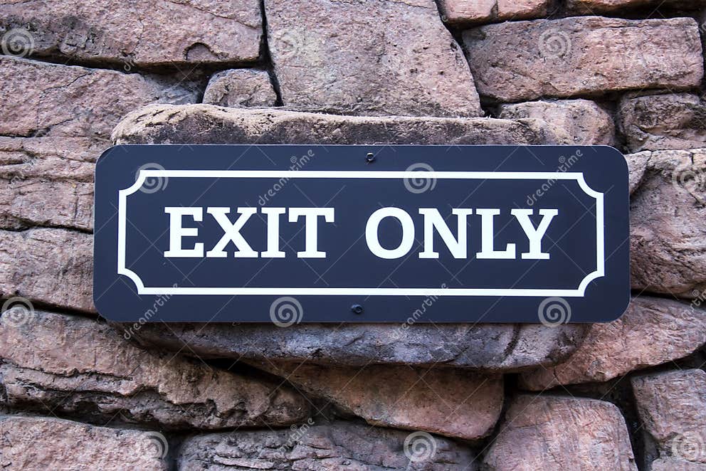 Exit Sign on Stone Wall stock image. Image of executive - 63174633