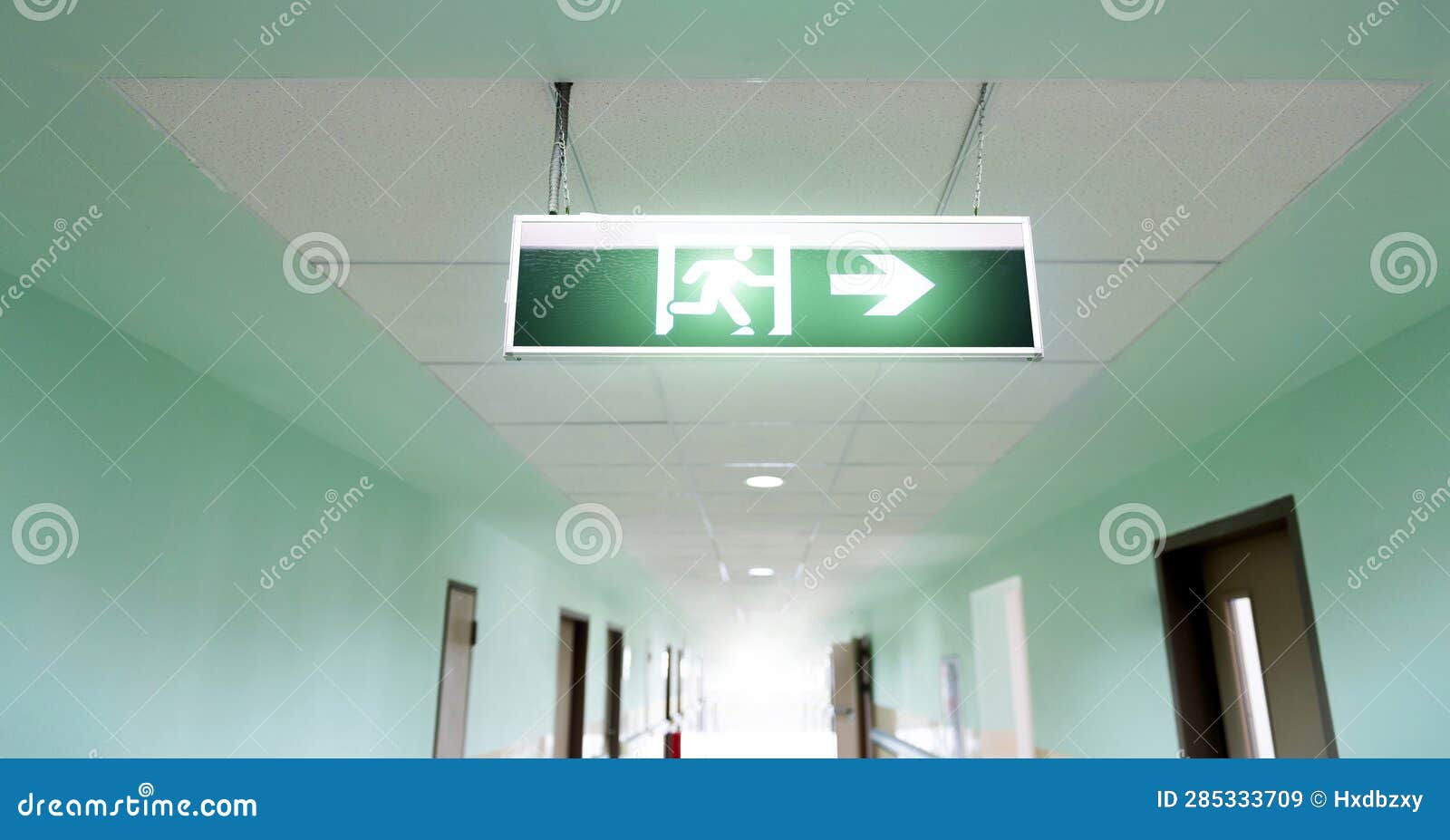 Exit Sign Suspended from the Ceiling of Hospital Stock Image - Image of ...