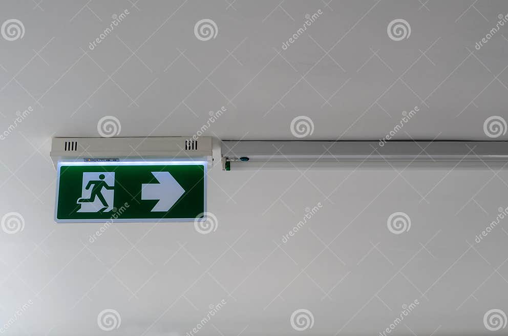 Exit Signs, Fire Exits and Arrows Pointing the Way on the Ceiling of ...