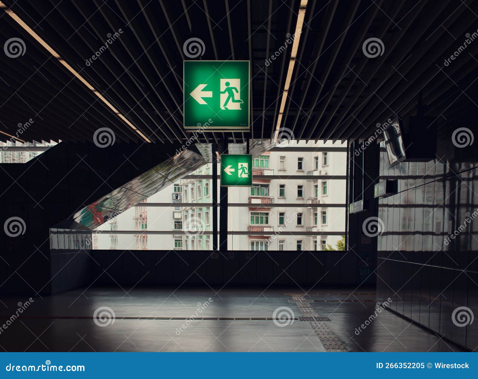 Exit Signs Illuminated with the Green Light in a Train Station ...
