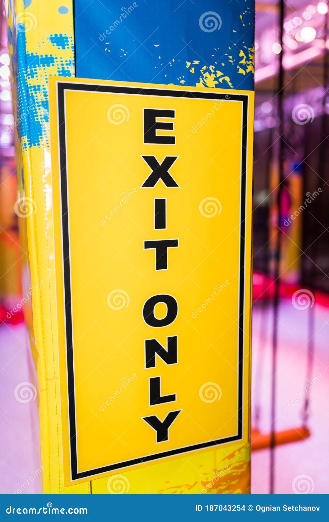 Exit only Yellow Sign in Indoor Amusement Center Stock Photo - Image of ...