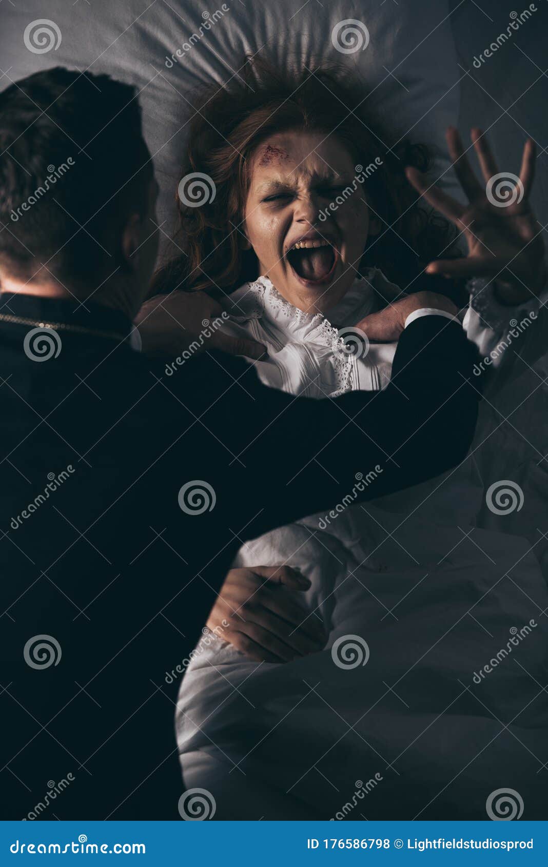 Exorcist Holding Yelling Female Demon in Stock Photo - Image of horror ...