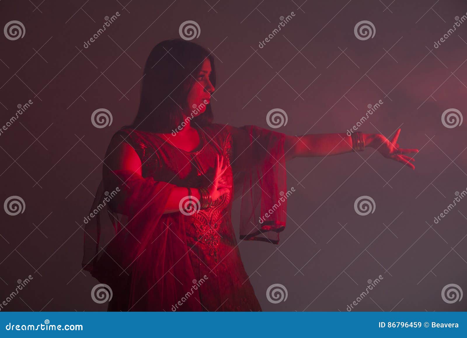Exotic Indian Woman Dancing on a Red Light Stock Image - Image of ...