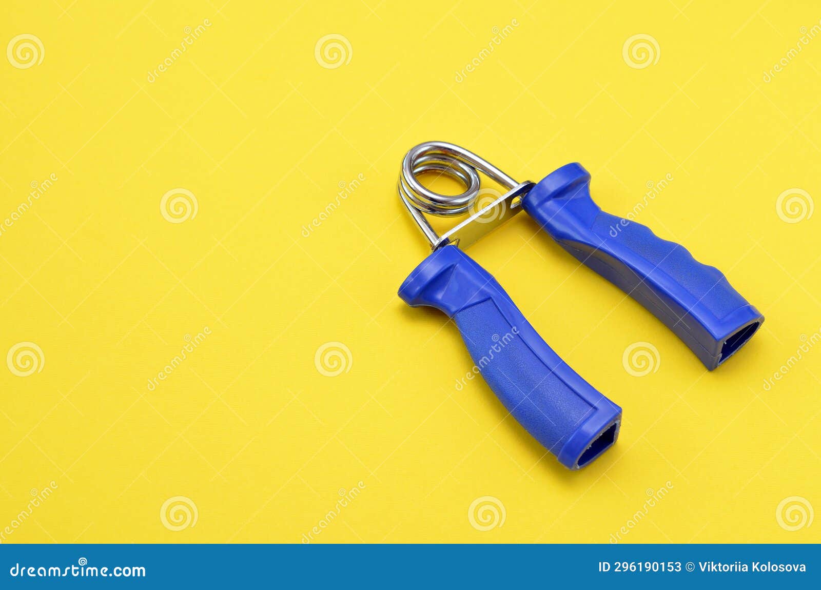 Expander with a Blue Handle on a Yellow Background Stock Image - Image ...