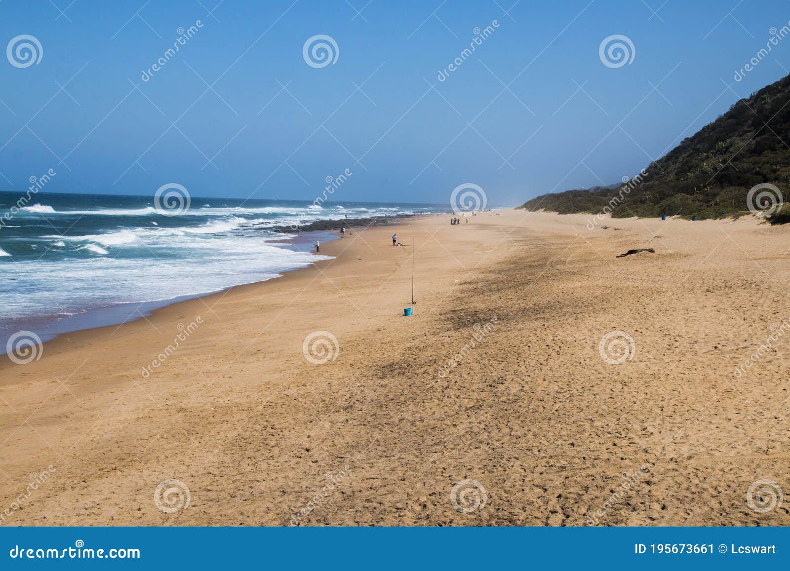 Expansive Beach Sand with Deep Blue Ocean and Clear Sky Stock Image ...