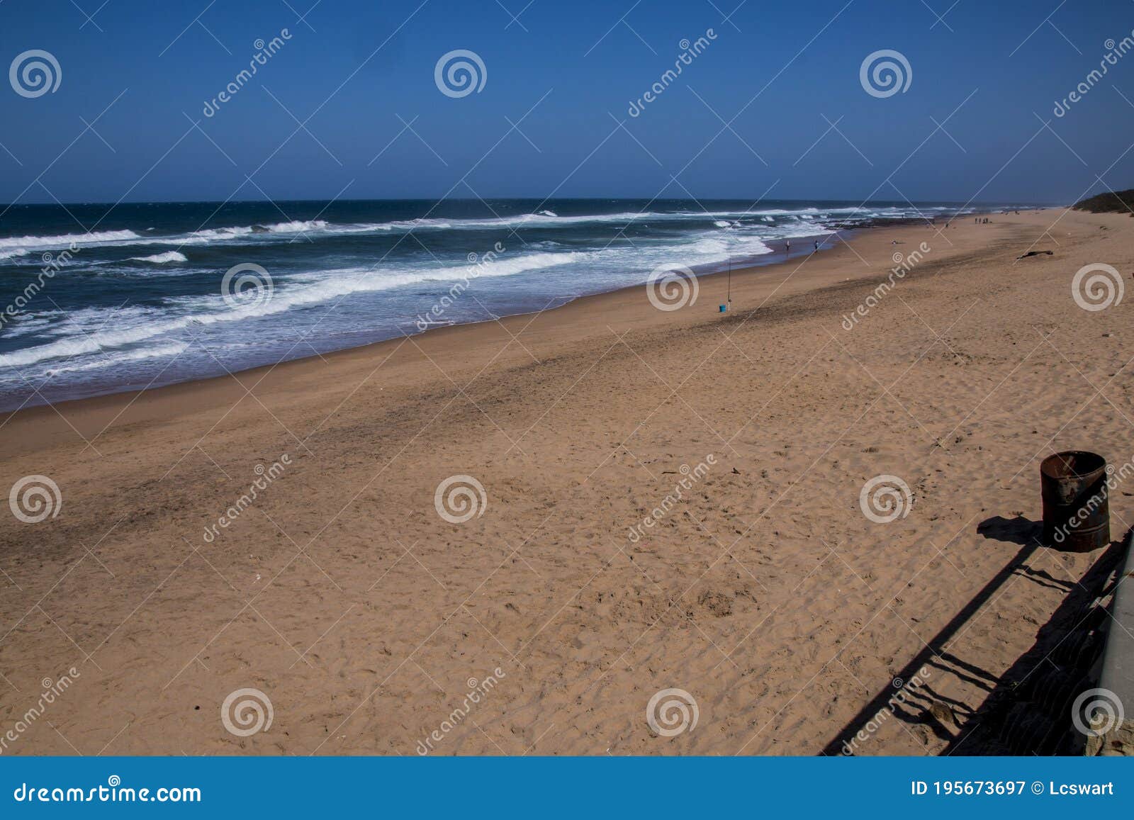 Expansive Beach Sand with Deep Blue Ocean and Clear Sky Stock Image ...
