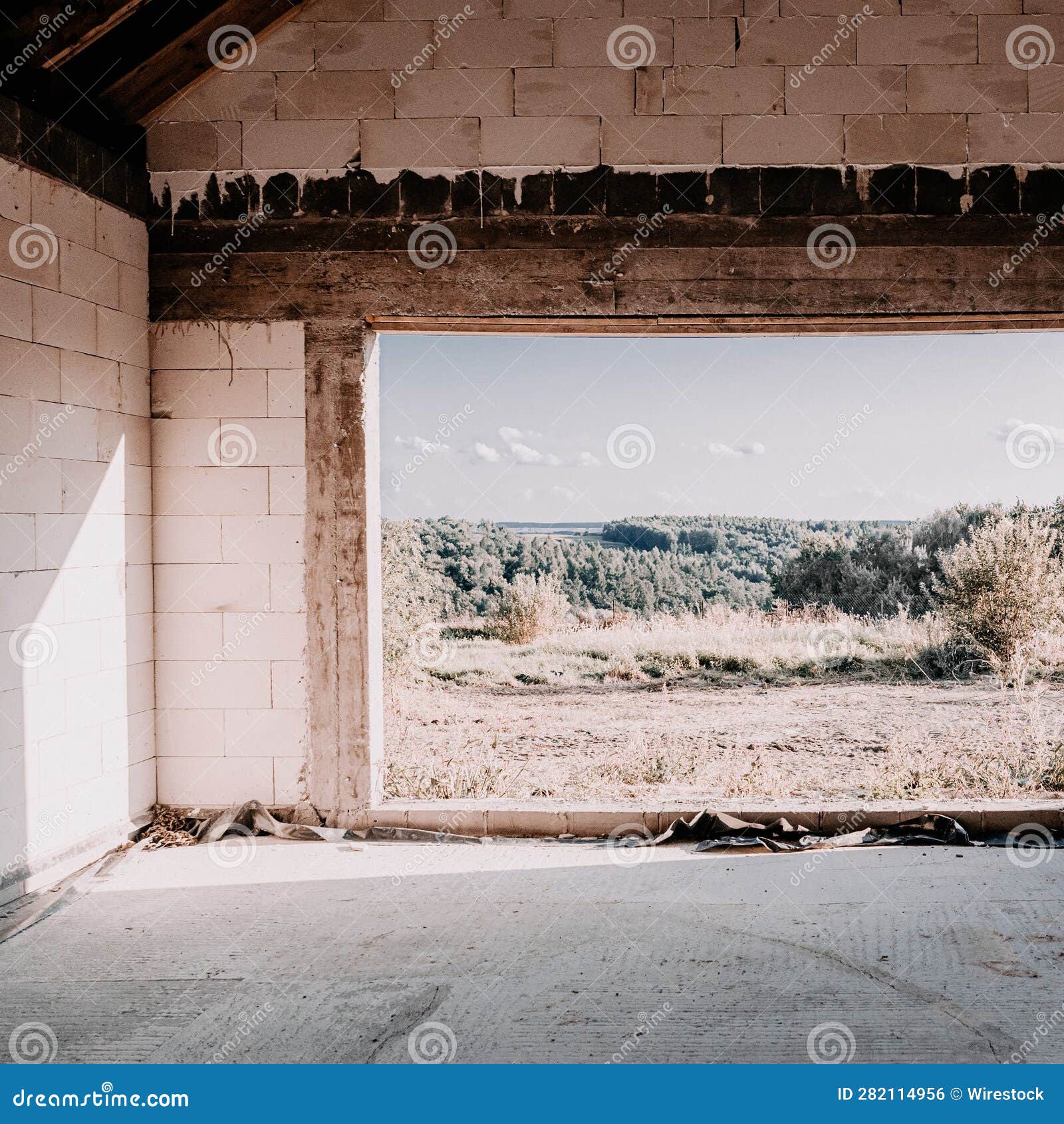 Expansive Interior Space Featuring a Large Window Providing a View of ...