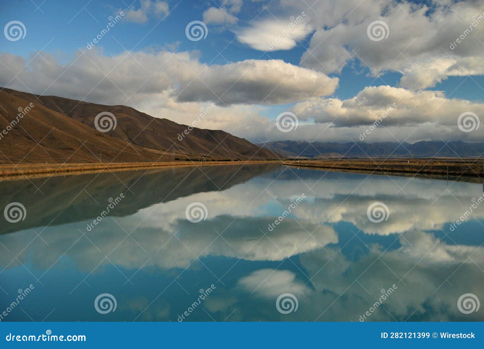 Expansive Lake Beneath a Cloudy Sky Stock Image - Image of water, clear ...