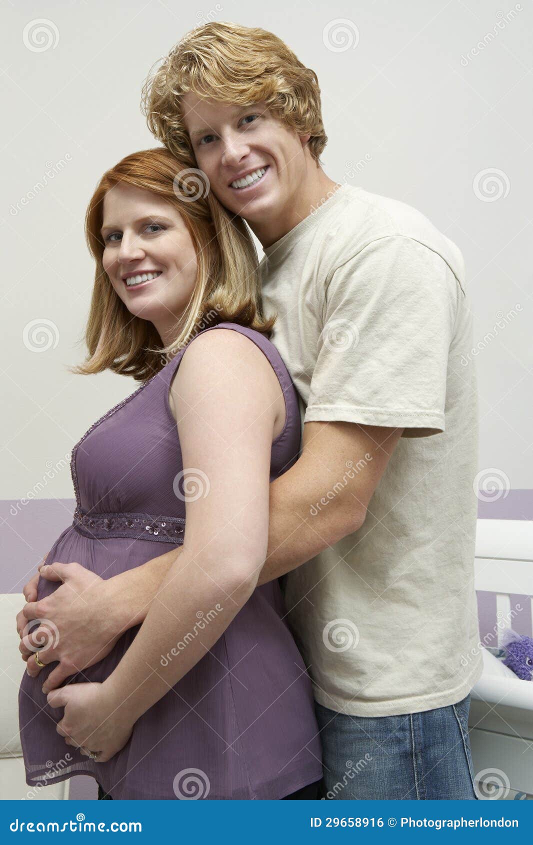 Expectant Couple Embracing at Home Stock Photo - Image of belly, person ...