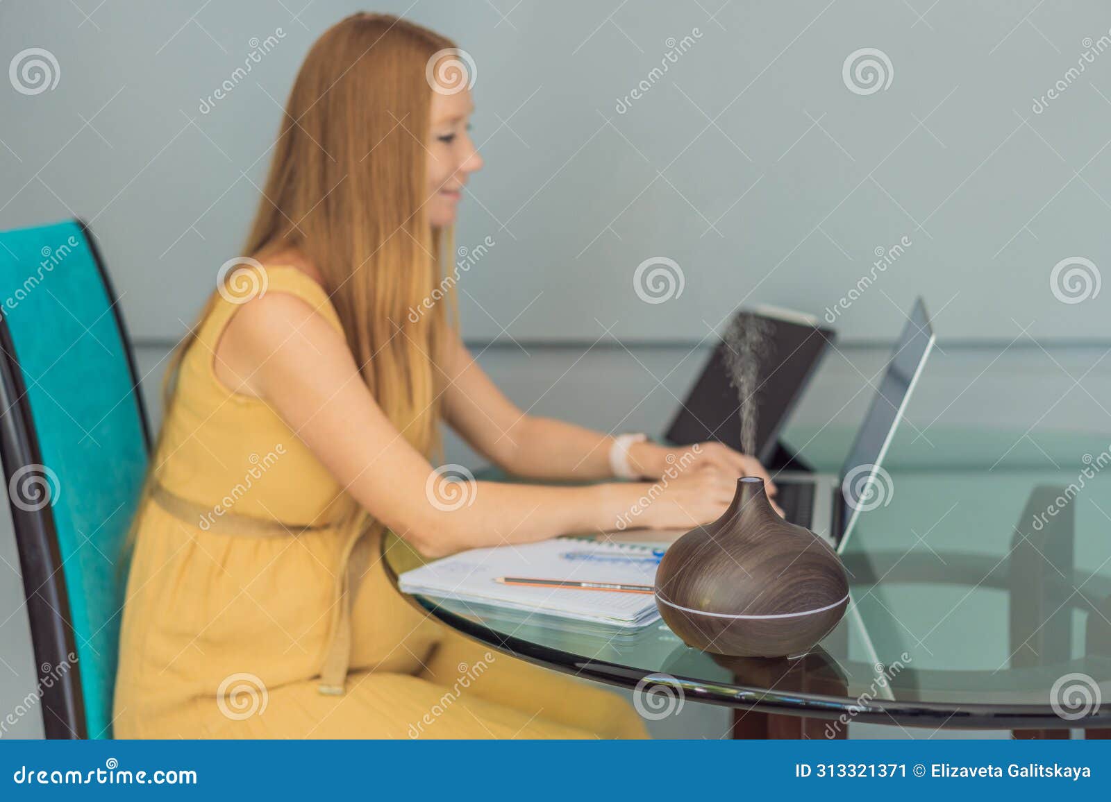 Expectant Woman Enhances Work Environment, Using an Aroma Diffuser for ...