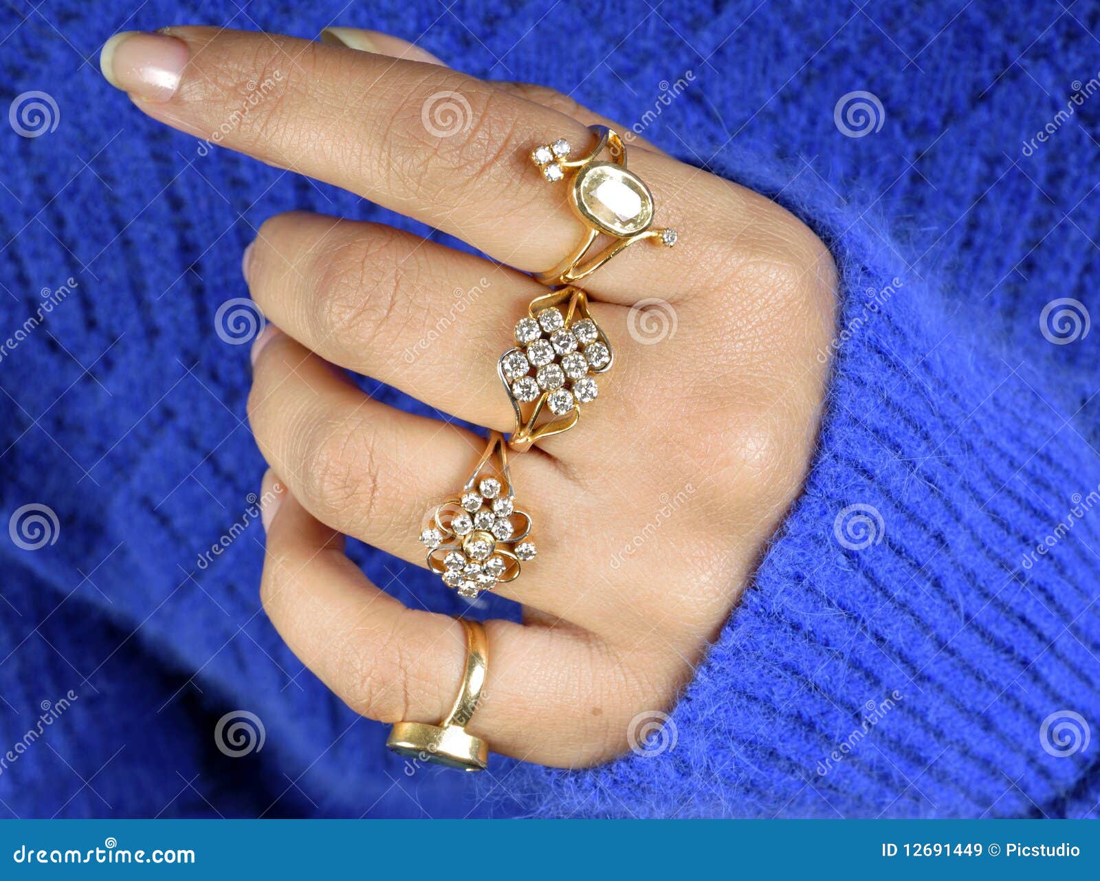 Expensive hand stock image. Image of colored, golden - 12691449