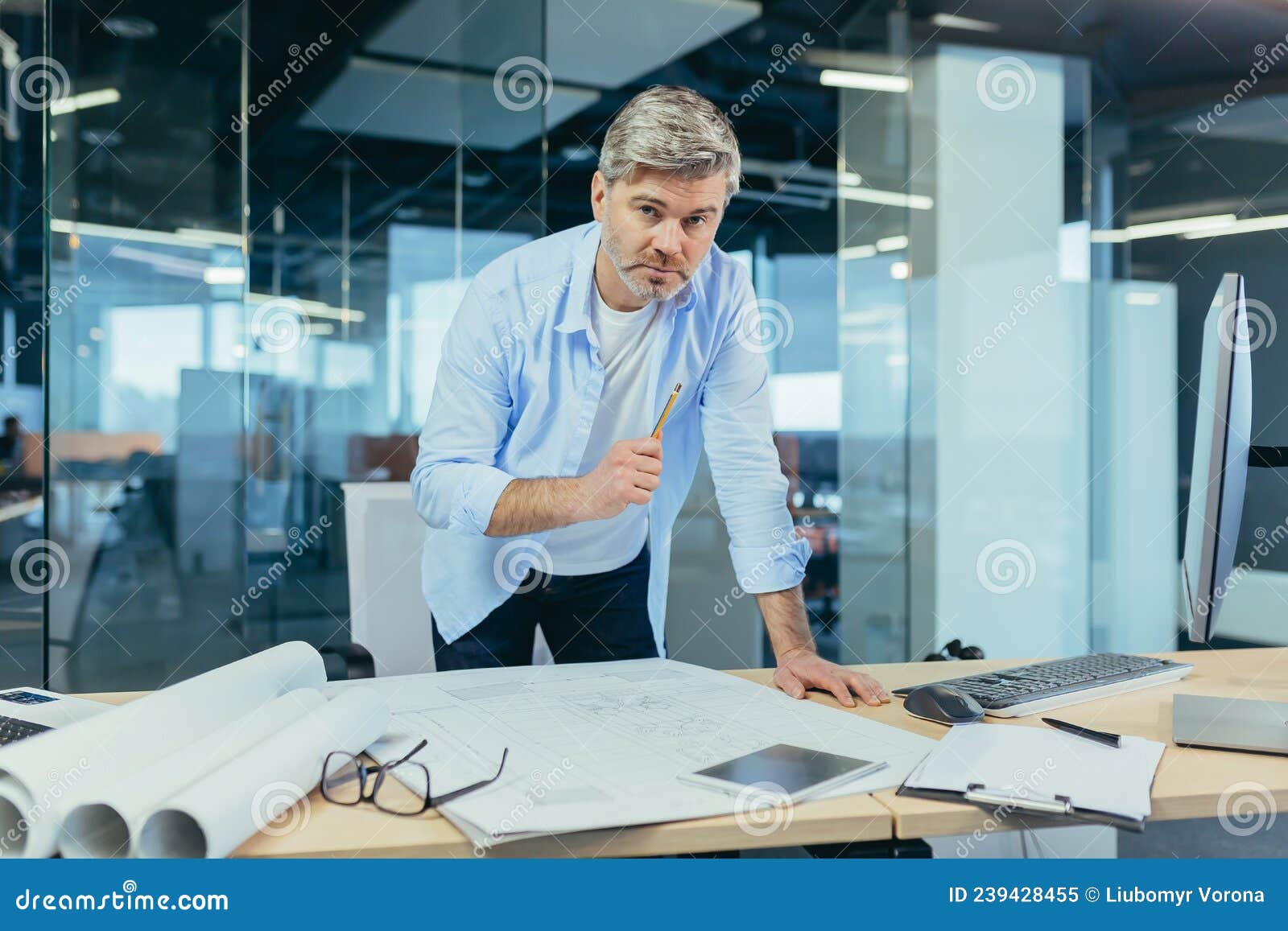 Architect, Working at the Office Desk on the Drawing, Makes Final Edits ...