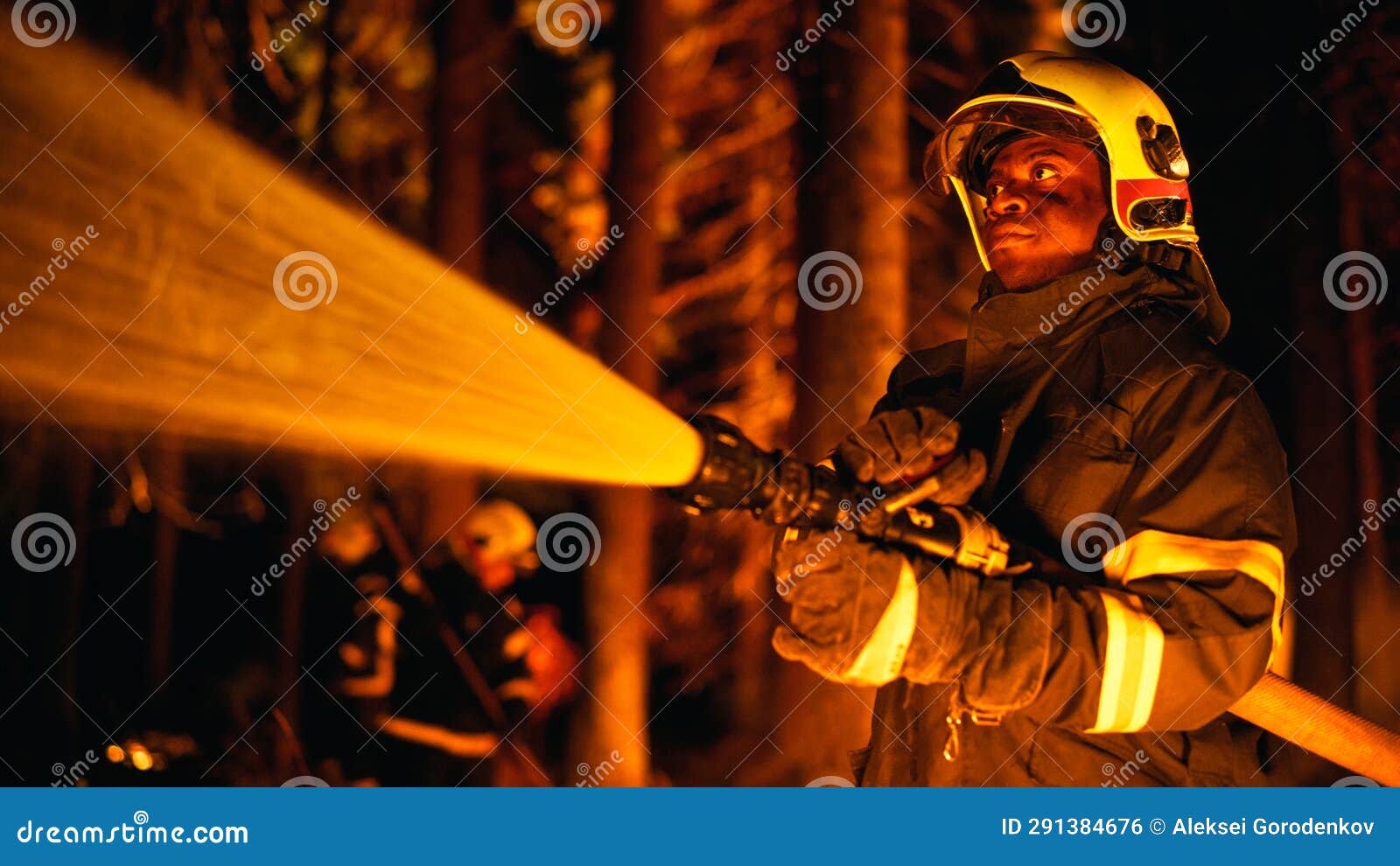 Firefighter Extinguishing Car Fire With Foam Jet And Oxygen Cylinder ...
